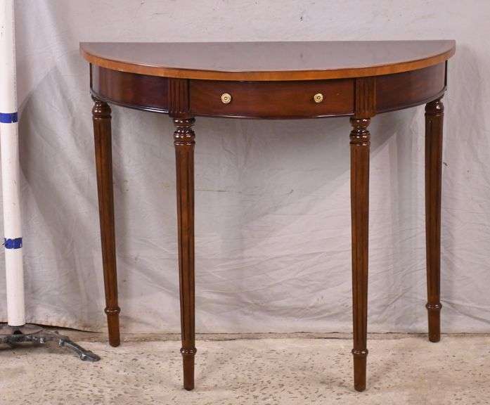 Mahogany half-round single drawer console table with fluted legs; 68 ...