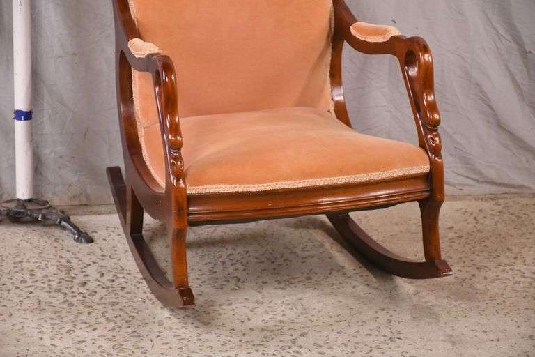 Carved swan head open arm rocking chair with peach color fabric; 253 ...