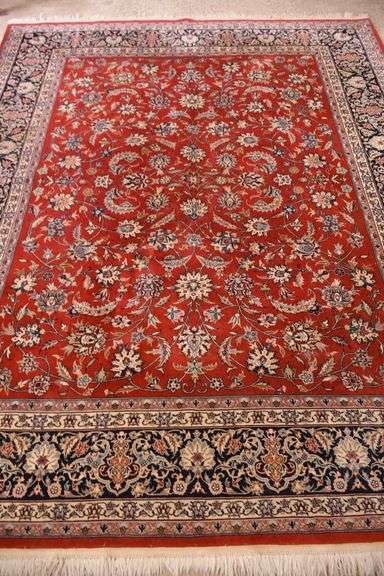 8x10 hand knotted rug with red field; 37-1971 - R.H. Lee & Co. Auctioneers