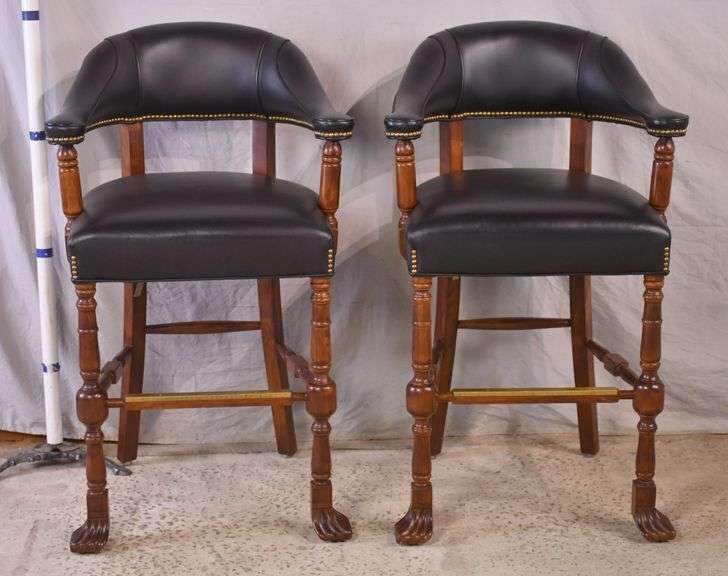 Pair of large curved back bar chairs with black leather seats and backs ...
