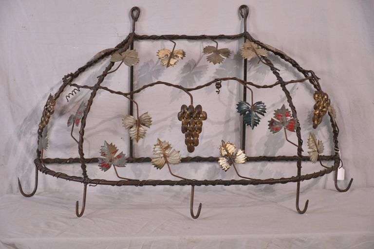 Ornate metal wall mounted pot rack; 869-320 - R.H. Lee & Co. Auctioneers