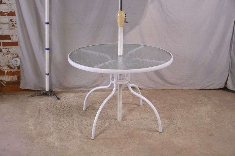 Round white metal patio table with wavy glass top and American flag ...