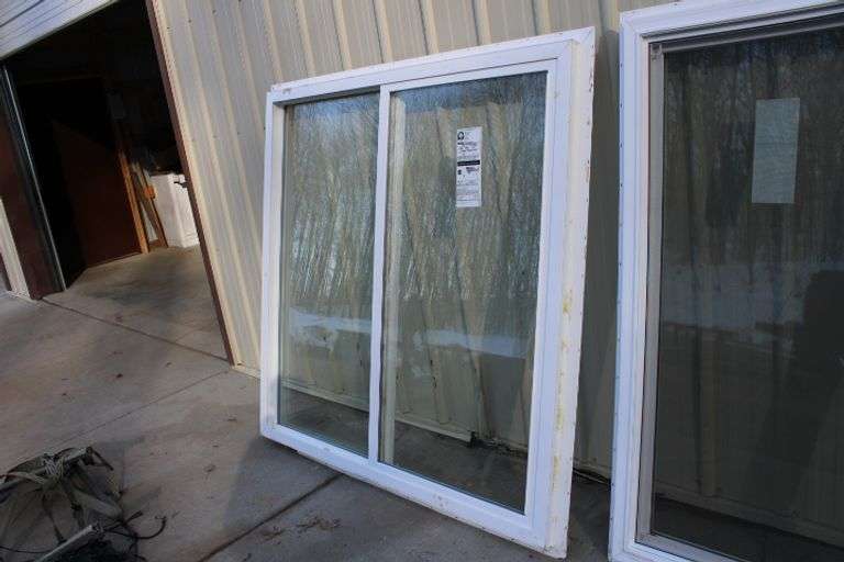 5' x 5' vinyl sliding window - Lee Real Estate & Auction Service