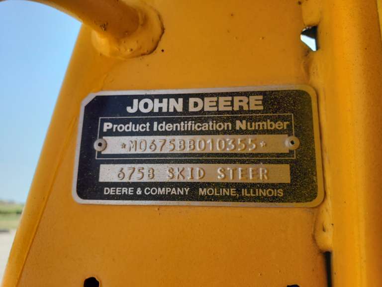 John Deere 675B skid steer - Adam Marshall Land & Auction, LLC