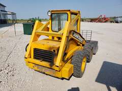 John Deere 675B skid steer - Adam Marshall Land & Auction, LLC