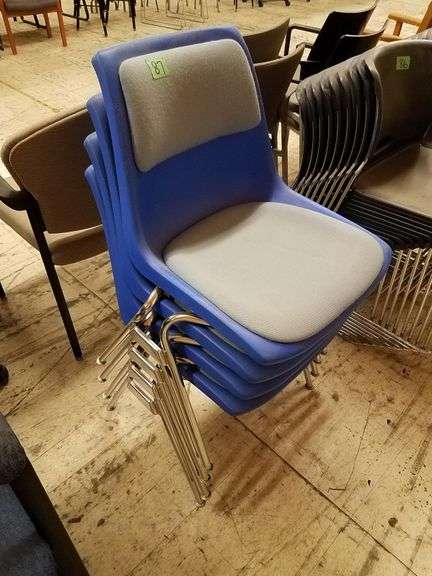 (4) Stacking blue padded chairs - Adam Marshall Land & Auction, LLC