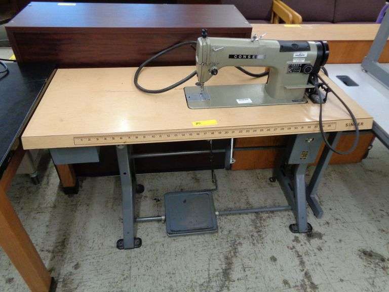 1 -CONSEW SEWING MACHINE W/ TABLE - Matthews Auctioneers