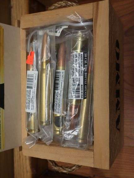 50 CAL BMGH BOTTLE OPENERS W/ DISPLAY - Matthews Auctioneers