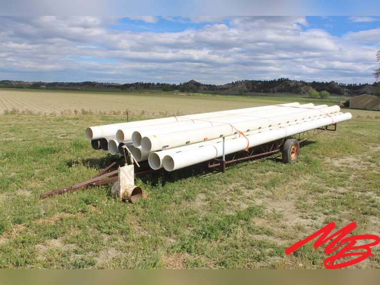 Pipe Trailer & 13 Jts Plastic/Alum gated pipe - Musser Bros Inc