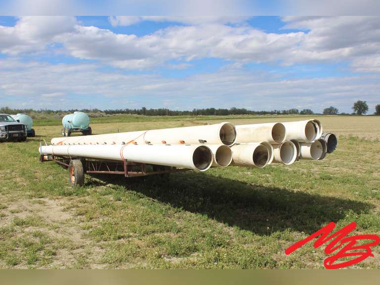 Pipe Trailer & 13 Jts Plastic/Alum gated pipe - Musser Bros Inc