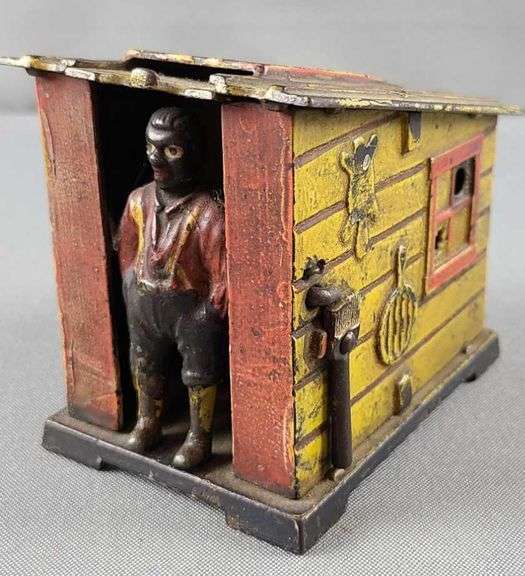 Black Americana cast iron mechanical bank - Matthew Bullock Auctioneers