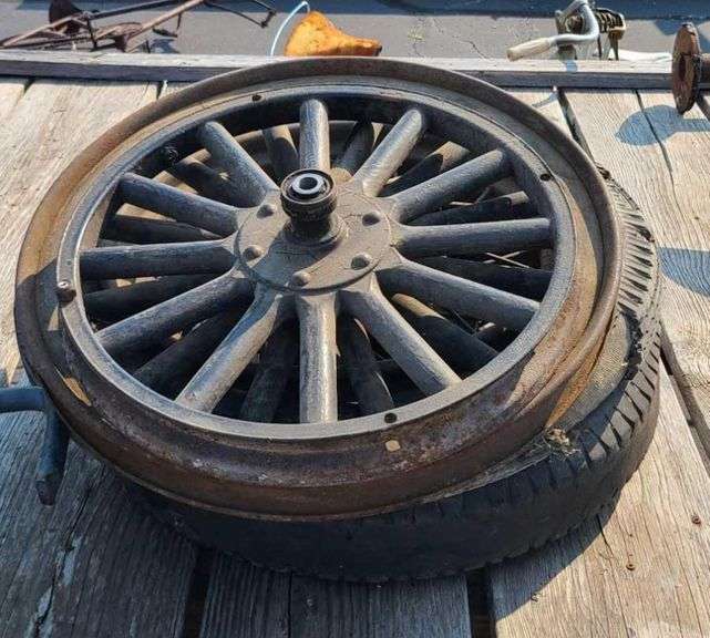 Group of Ford Model T tires and rims - Matthew Bullock Auctioneers