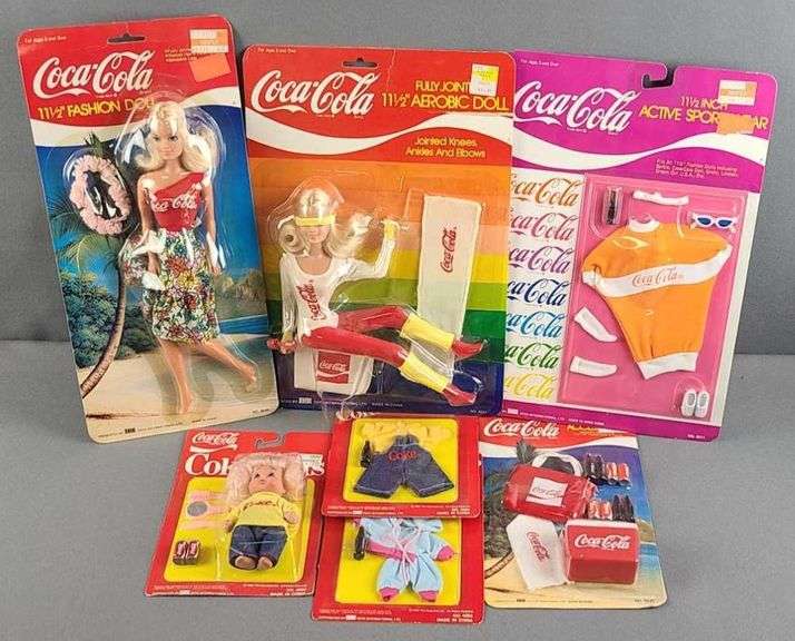 Group of Coca-Cola dolls and accessories - Matthew Bullock Auctioneers