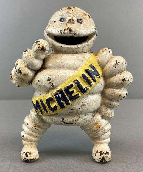 Michelin Man Cast Iron Coin Bank - Matthew Bullock Auctioneers