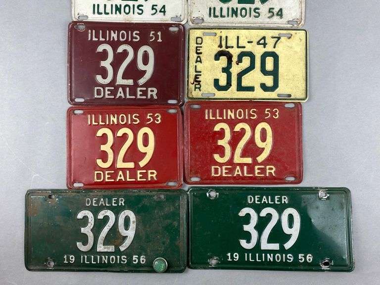 Group of 8 Illinois Dealer License Plates - Matthew Bullock Auctioneers