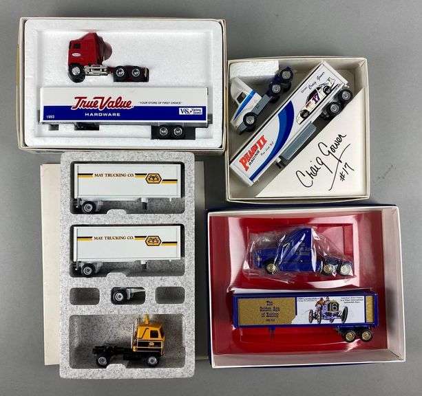 Group of 4 Die-Cast Semi Trucks and Trailers - Matthew Bullock Auctioneers