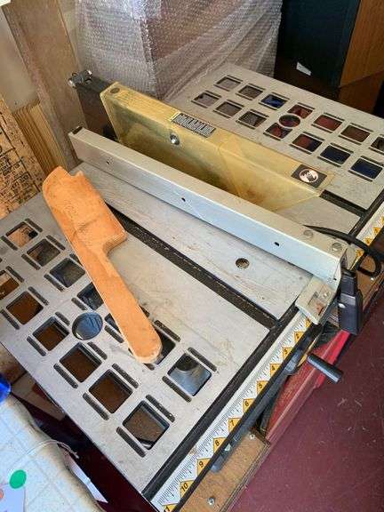 Ryobi 10" table saw on work stand - McNatt Real Estate