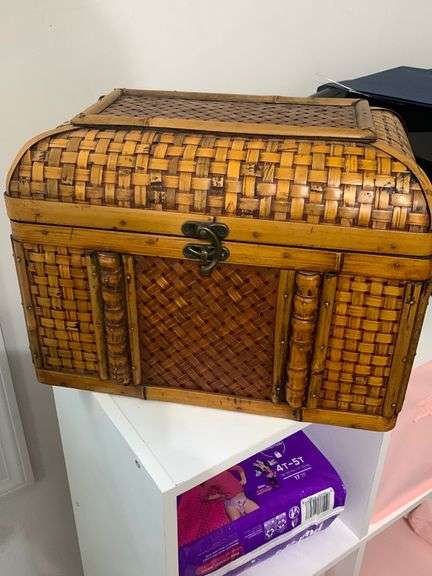 Wicker hope chest with eye glasses and movie - McNatt Real Estate