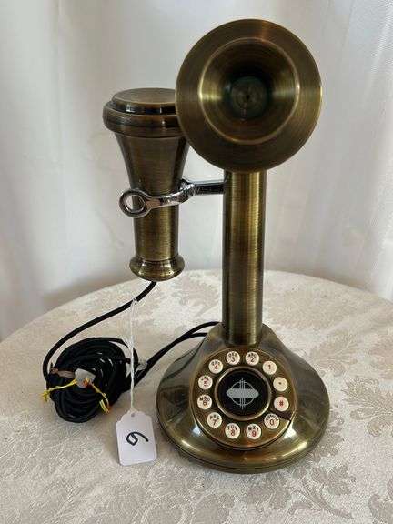Replica of an early stick telephone - McNatt Real Estate
