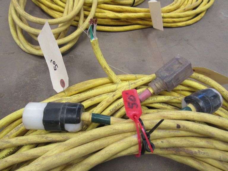THREE 50 FOOT POWER CORDS ONE NEEDS REPAIR - McPherson Auction & Realty