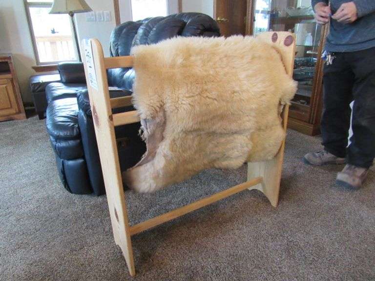 SHEEP SKIN RUG WITH BLANKET RACK - McPherson Auction & Realty