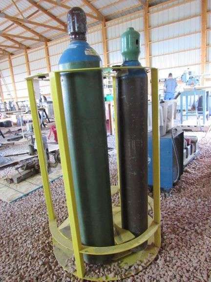 ROTATING BOTTLE STAND W/ A OXYGEN BOTTLE AND ARGON BOTTLE - BOTTLES ARE ...