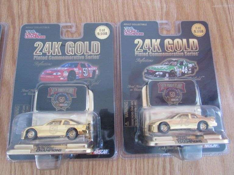 BOX OF 6 24K GOLD RACING CHAMPIONS CARS - McPherson Auction & Realty