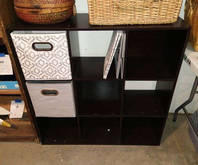Black storage shelf with nine cubbies (36" x 36"); includes four gray ...
