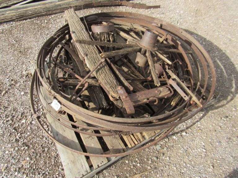 PALLET OF WAGON WHEEL & AXLE PARTS - McPherson Auction & Realty