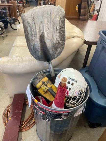 Trash can with scoop shovel, helmet, light, flag - Metzger Property ...