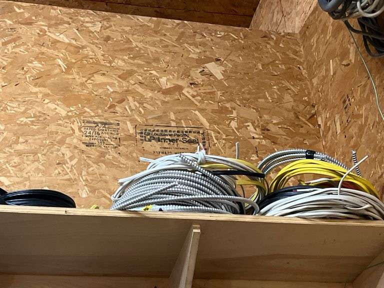 Wiring and flex conduit on shelf - Metzger Property Services LLC