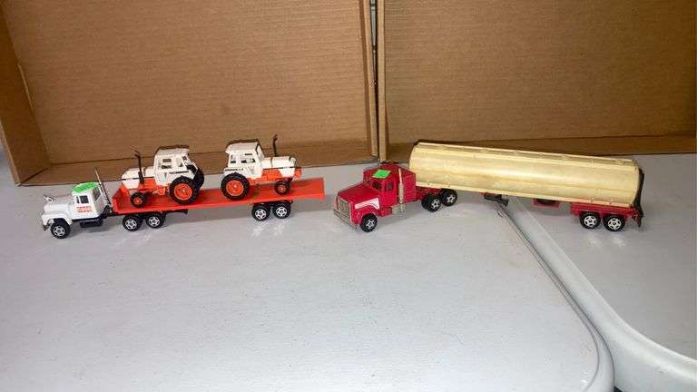 2 Die-cast semis - Case IH flatbed with two tractors & unmarked ...