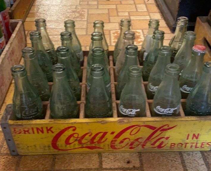 Yellow wood Coca-Cola case with 24 Coca-Cola bottles - Metzger Property ...