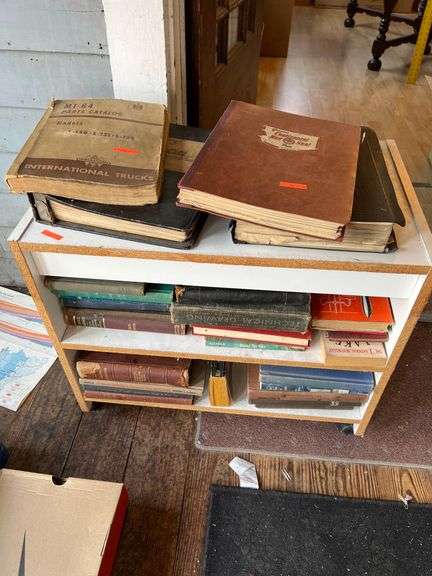 Assorted Books & Shelf - Metzger Property Services LLC