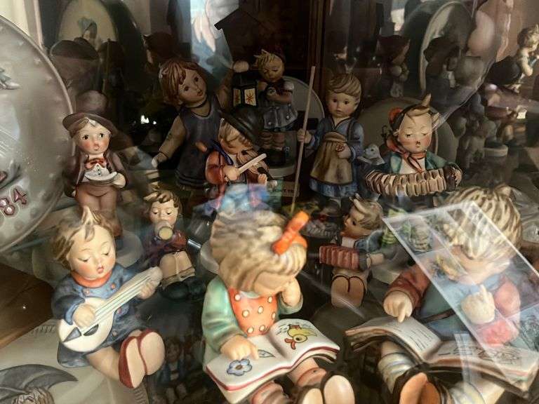 Goebel Hummel figurines and collector plates, contents of shelf ...
