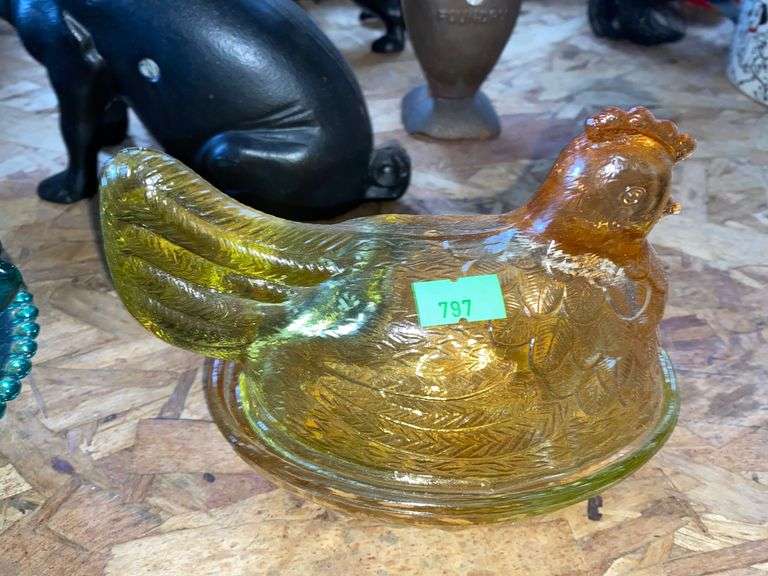 Yellow glass hen on nest - Metzger Property Services LLC