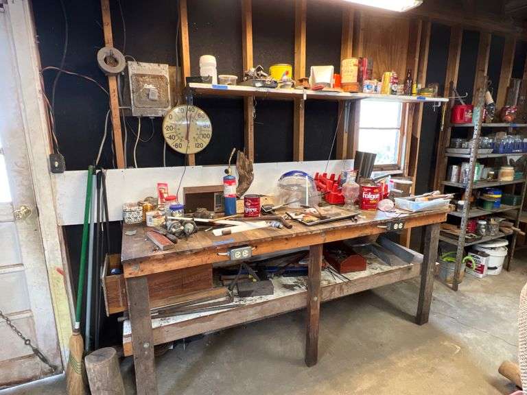 Contents on top of workbench, shelf above workbench, and corner to the ...
