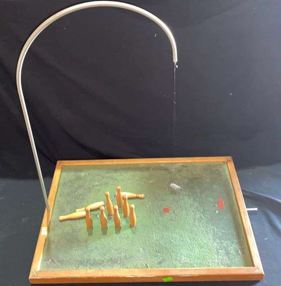 Table top pendulum bowling game - Metzger Property Services LLC