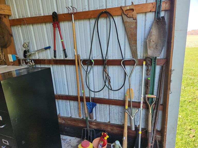 Bolt cutter, pitch fork, hand saw, yard decor, gas container, kerosene ...