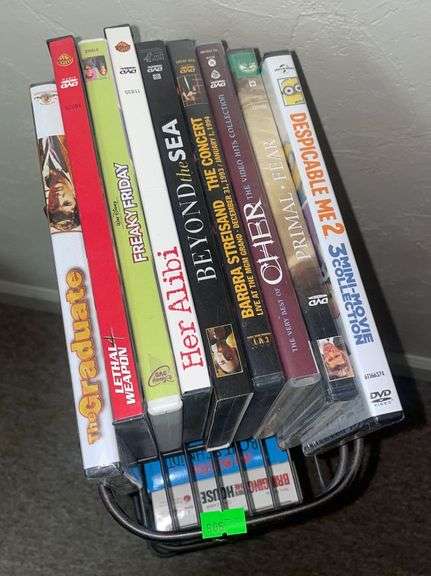 VHS and DVDs in stand - Metzger Property Services LLC