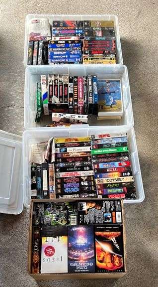 Assorted VHS movies in totes with lids - Metzger Property Services LLC