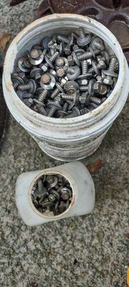 Assorted containers of bolts - Metzger Property Services LLC