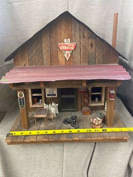 Miniature store front with a night light, wooden elephant display ...