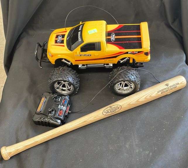 Radio controlled New Bright Ford F-150 and miniature baseball bat ...