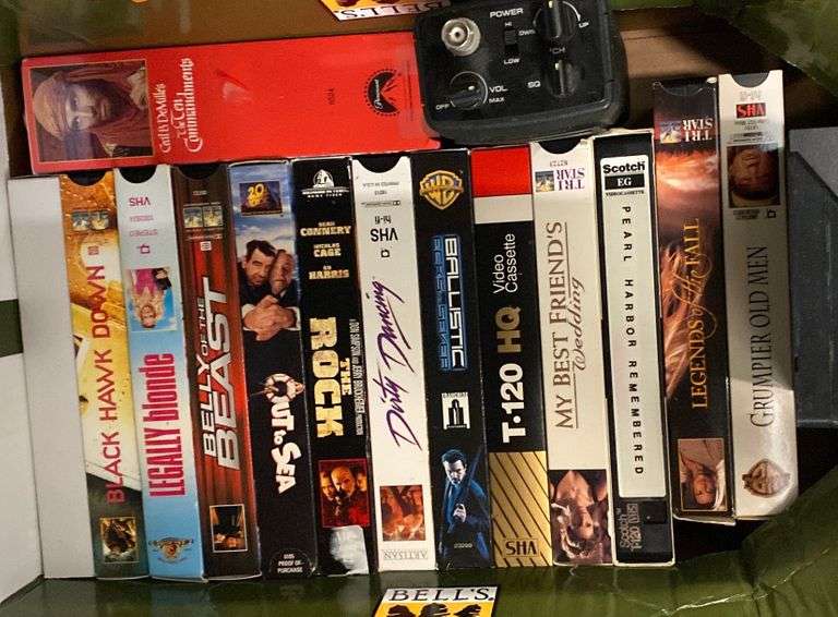 Two boxes with VHS tapes, box with decor - Metzger Property Services LLC