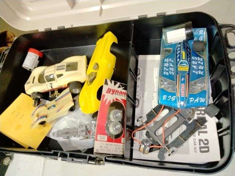 Plano Box with model car parts - Metzger Property Services LLC