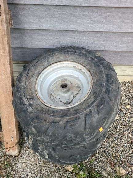 Atv rims and tires set of two - Metzger Property Services, LLC