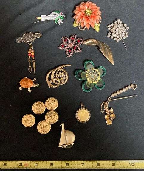 Brooche assortment and button covers - Metzger Property Services LLC