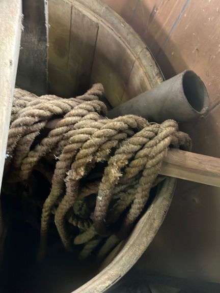 Wood barrel with pitch fork, rope & primitive contents 33x23in ...