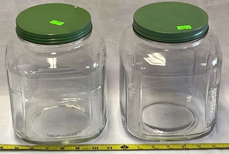 Two Vintage Glass Jars with Metal Lids 8.25” (one lid has a dent on top ...
